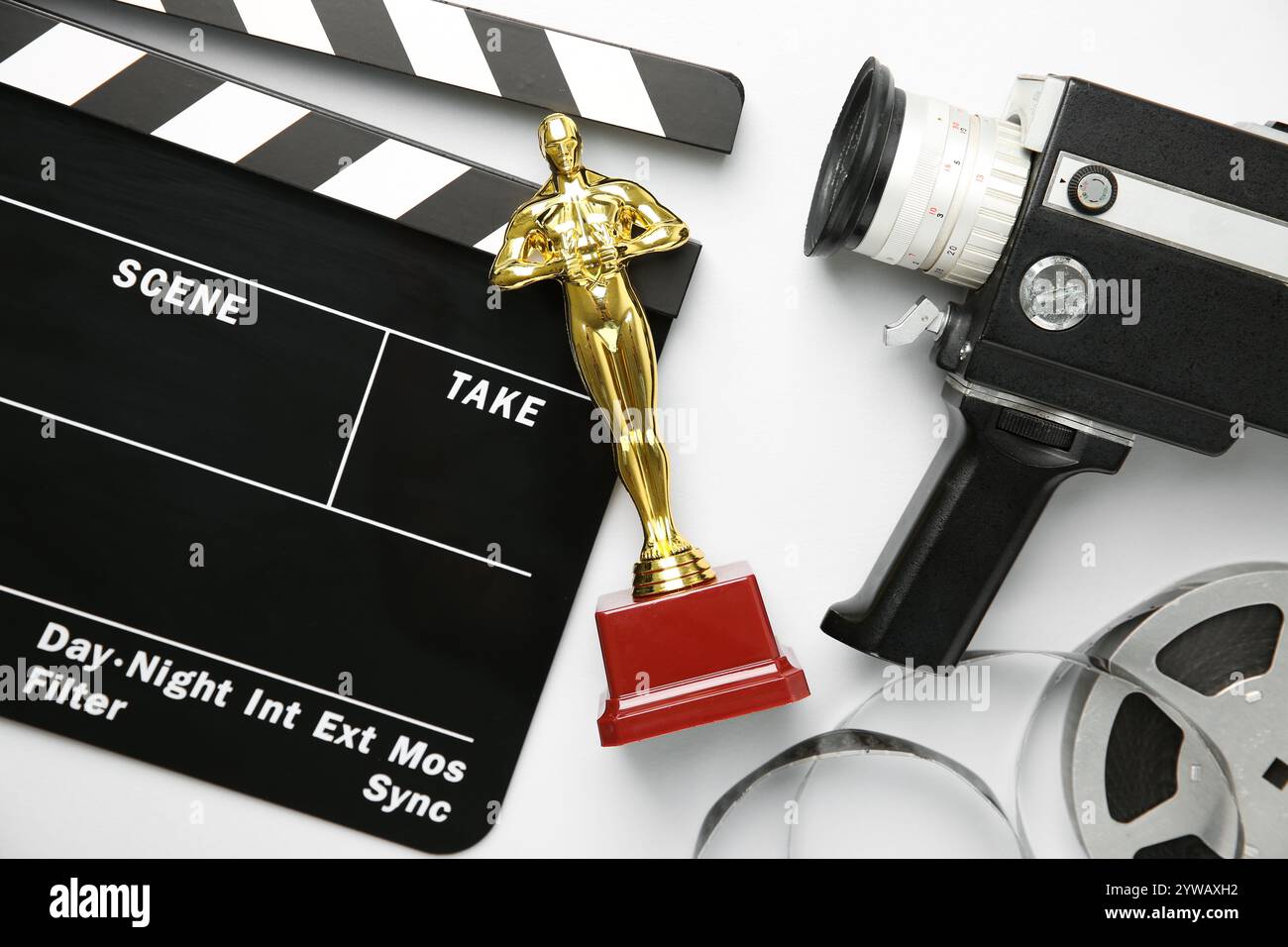 Golden trophy in shape of human figure, movie clapper, film reel and ...