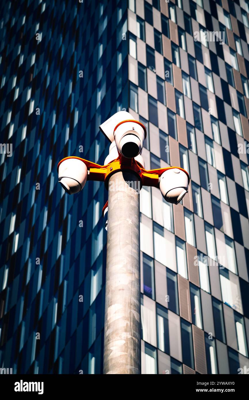 Security cameras on a building site in front of a new high rise tower ...