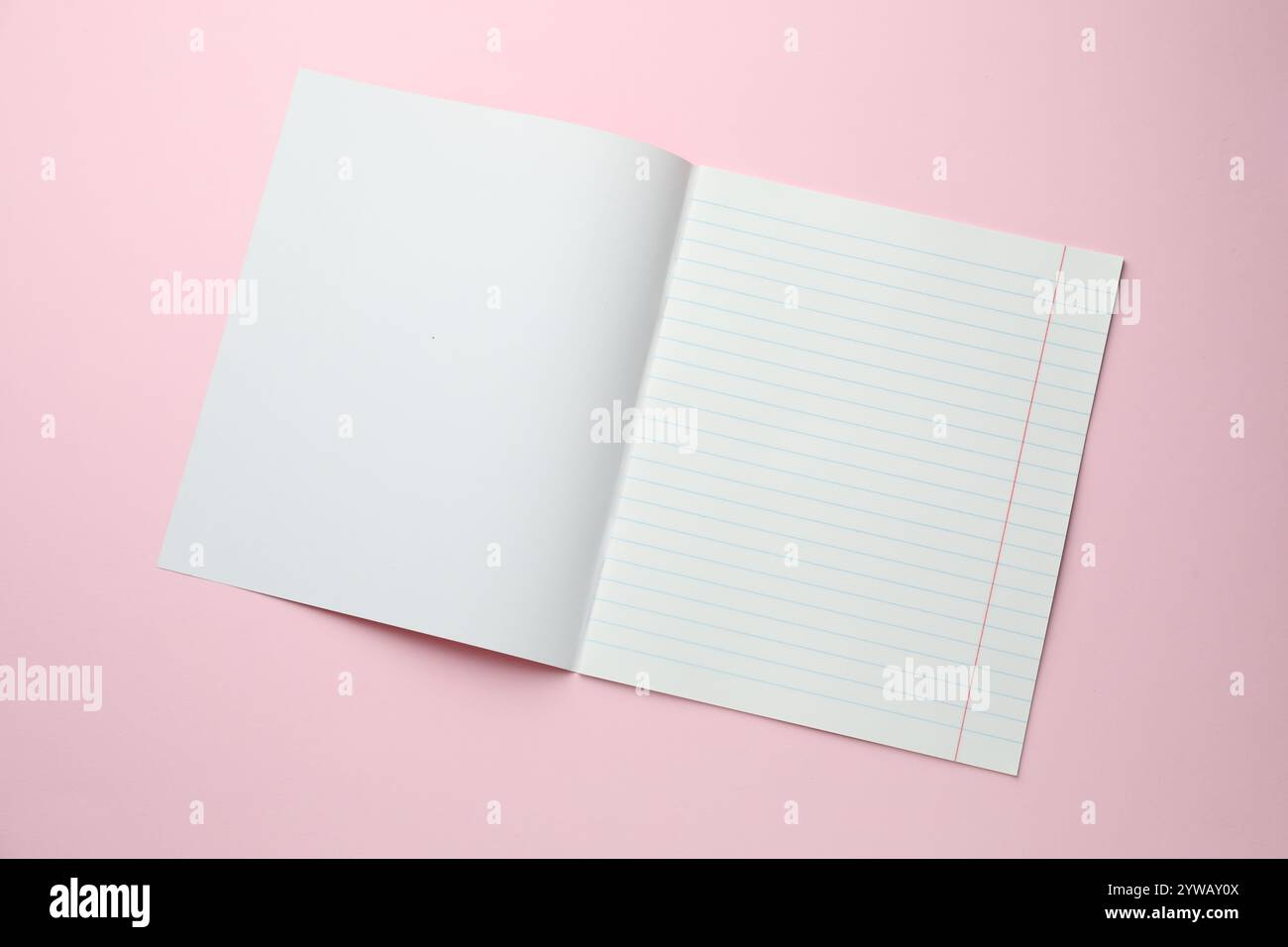 Open copybook on pink background, top view. School stationery Stock ...