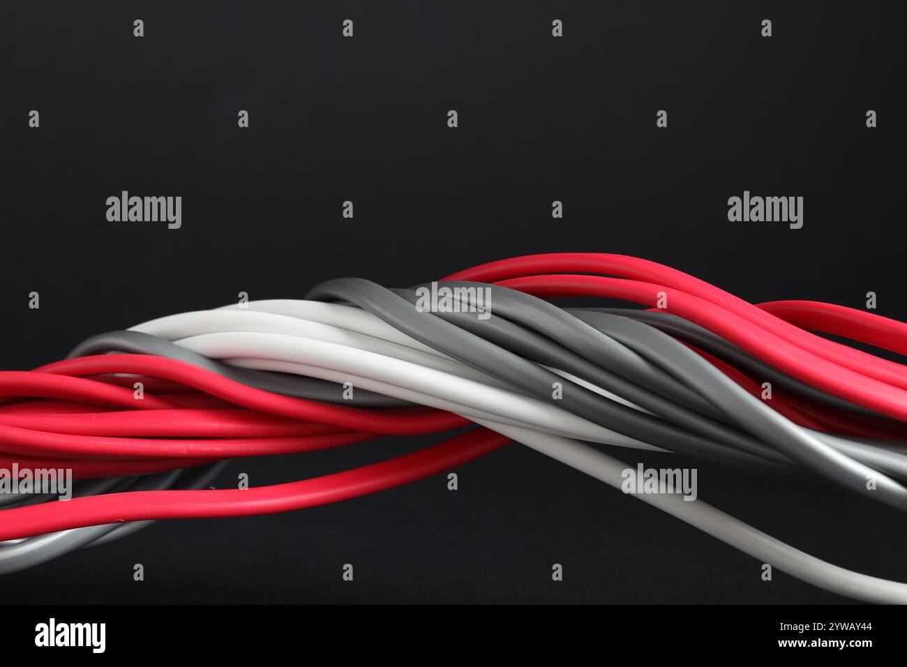 Many electrical wires on black background, closeup Stock Photo - Alamy