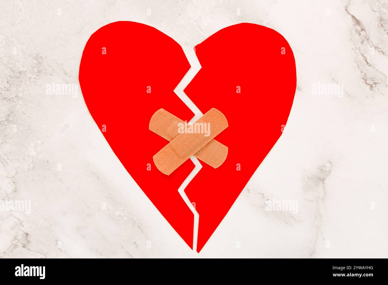broken heart with band-aid, adhesive bandage, concept Stock Photo - Alamy