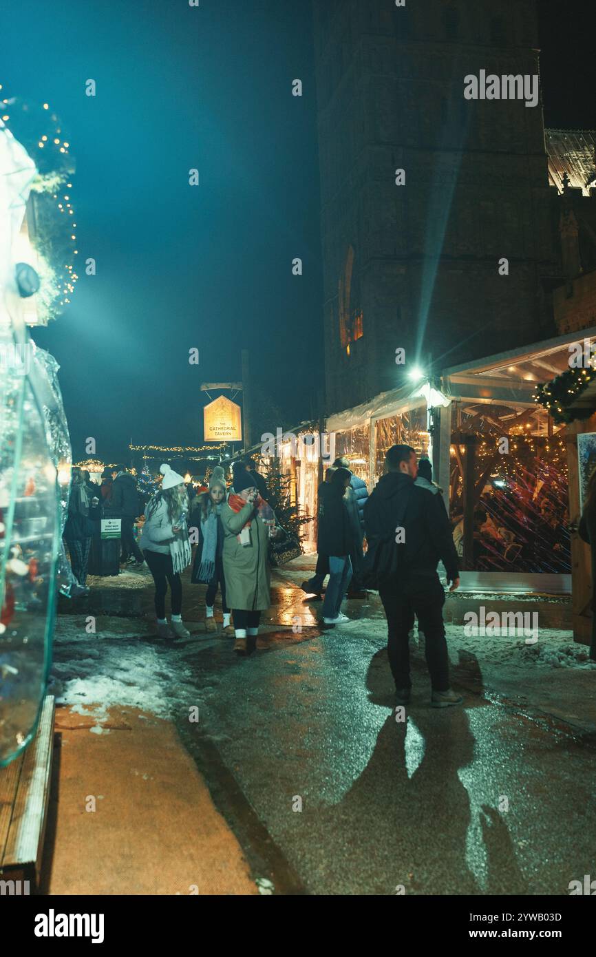 People walking past bar in Exeter Christmas market at night Stock Photo ...