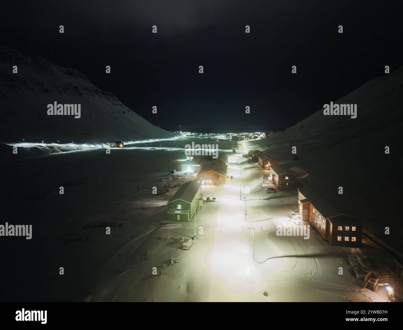 Drone shot of a street in Nybyen at night in Longyearbyen, Svalbard ...