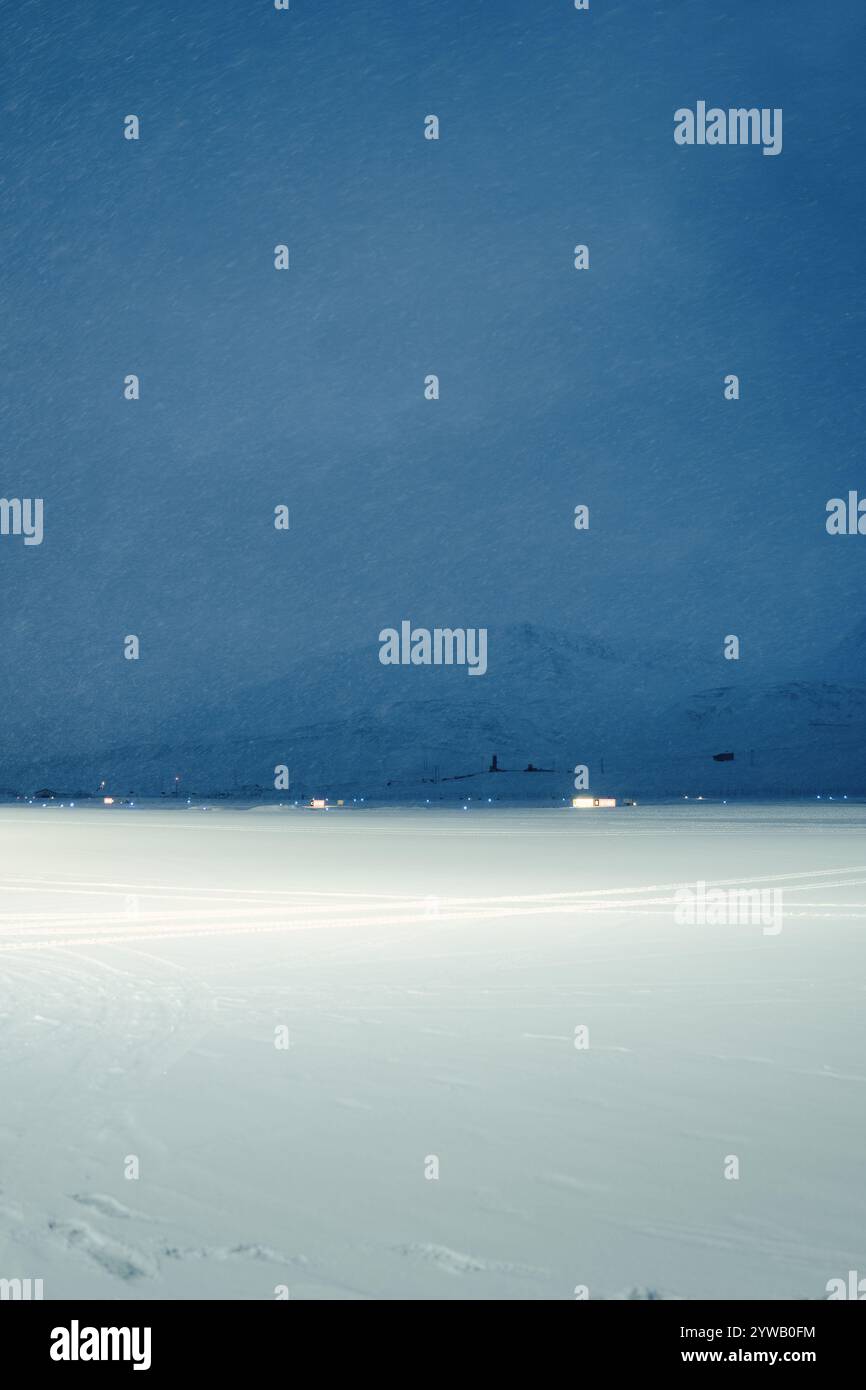 Snowy runway at Longyearbyen airport at night in Svalbard Stock Photo ...