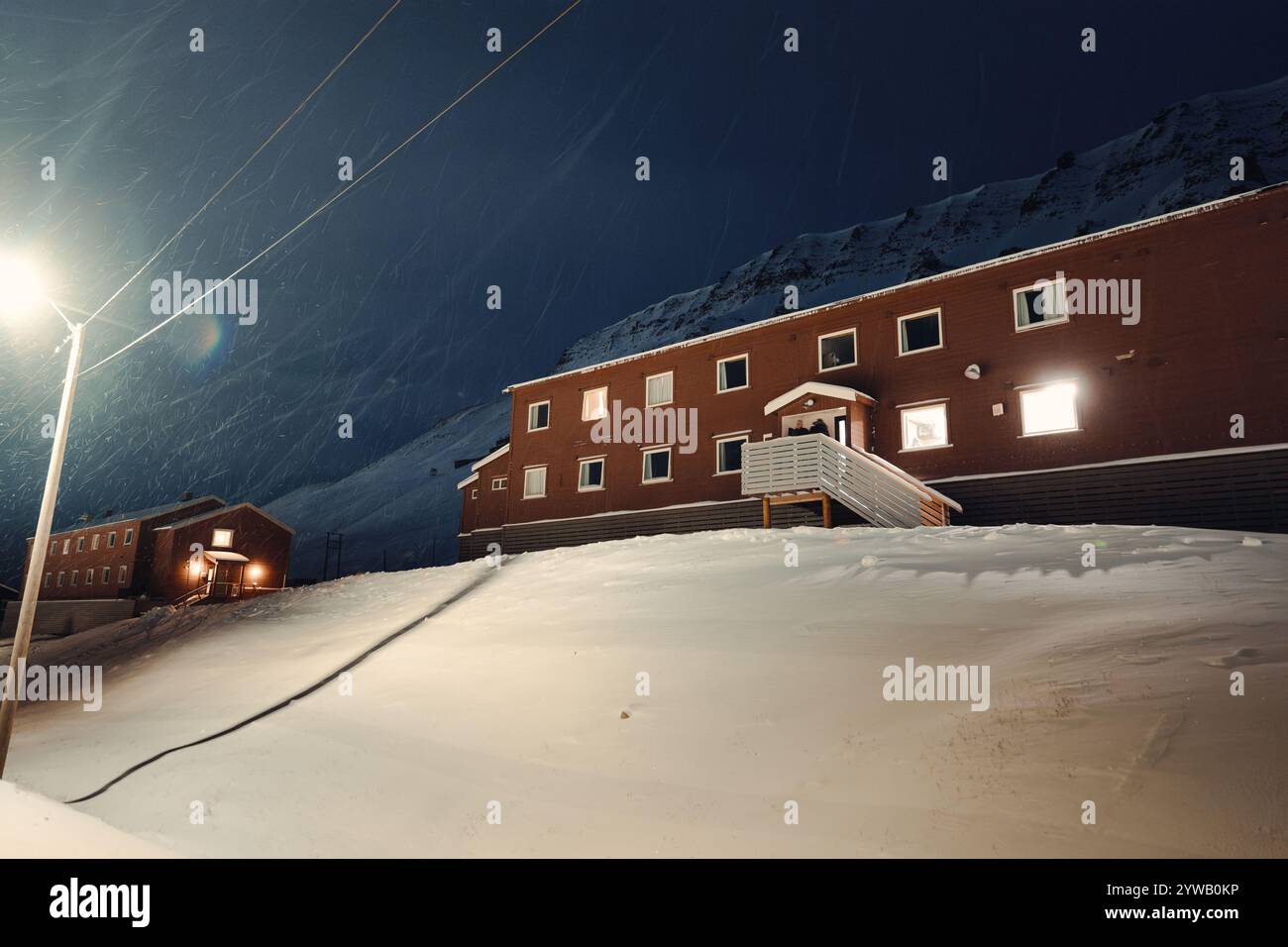 Old miner's cabins buildings in Nybyen in snowy night, Longyearbyenl ...