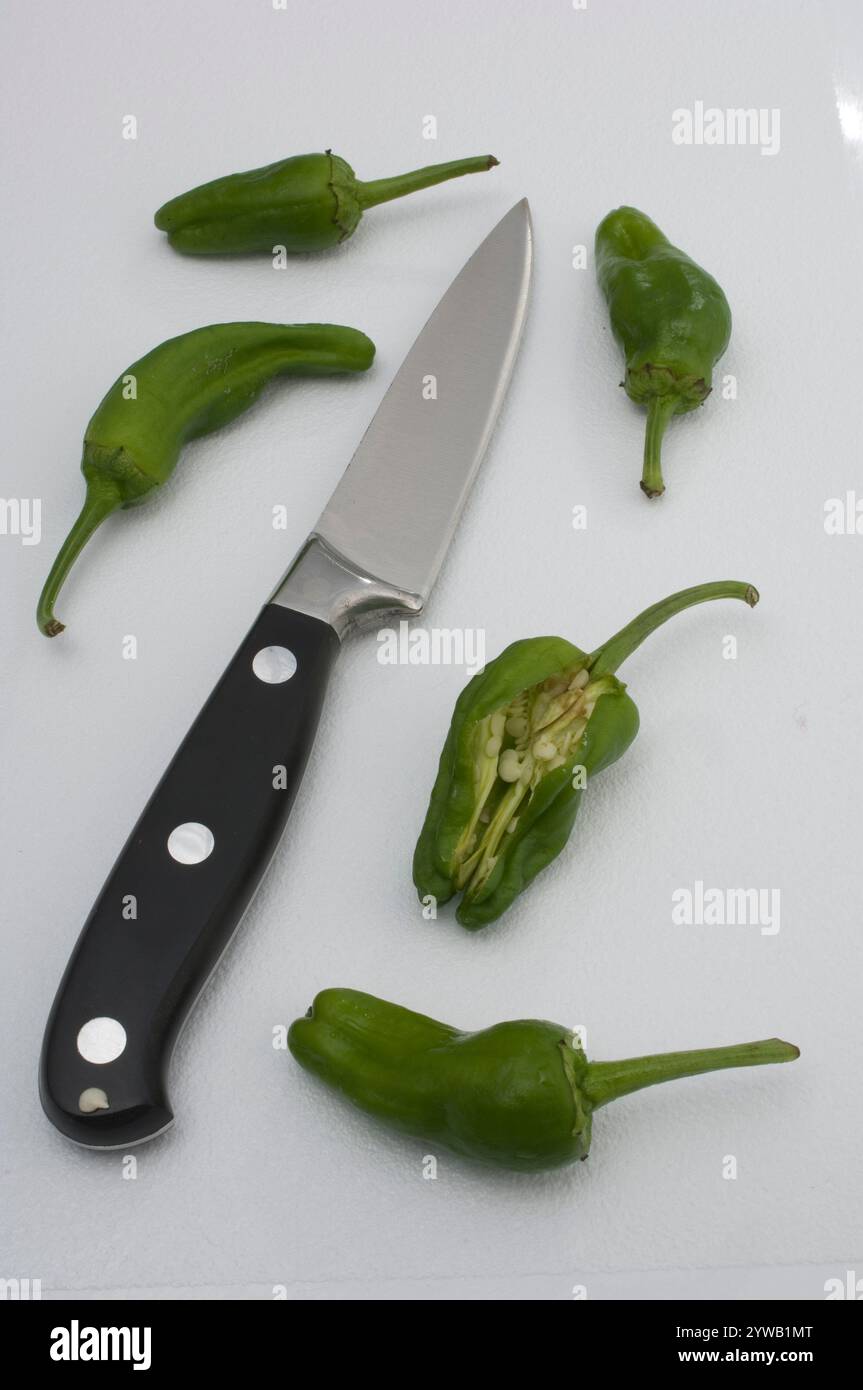 Conseptual shot of a Knife besides cut vegetables from a grocery Stock ...