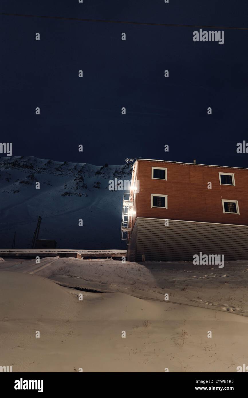 Wooden cabin on snowy arctic mountain in Longyearbyen, Svalbard Stock ...
