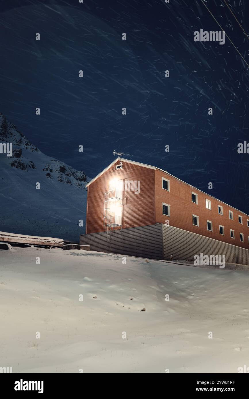 Old miners cabins in snowy night in Longyearbyen, Svalbard Stock Photo ...