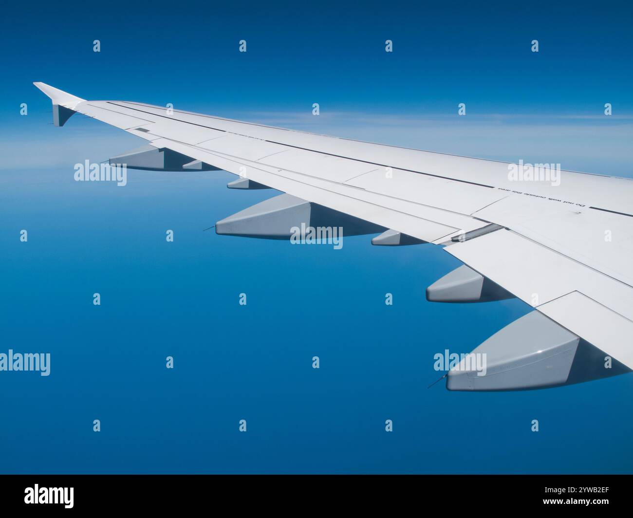 Inflight view of the left wing of a commerical airplane over the ...