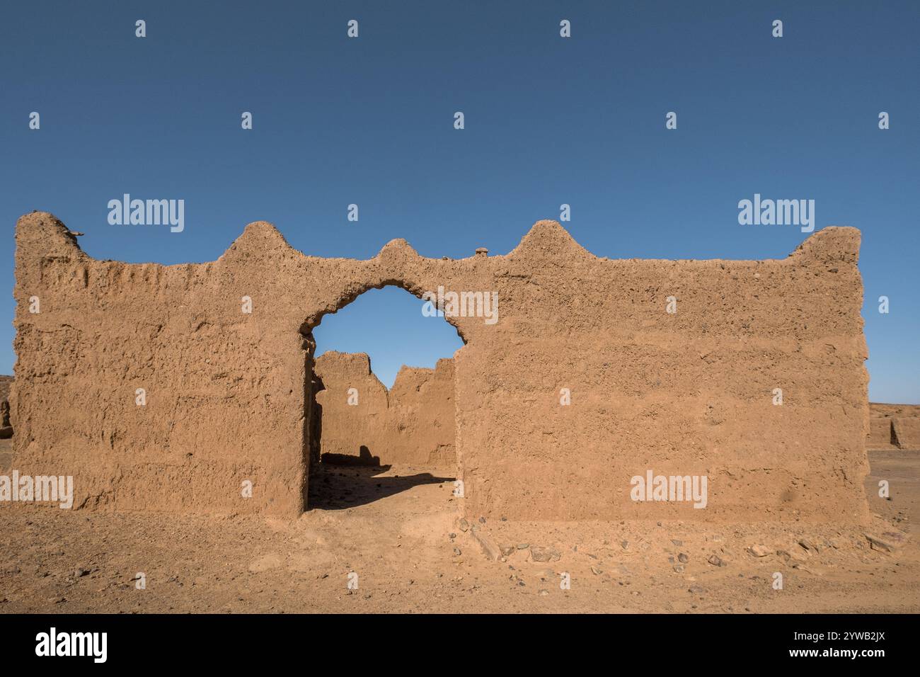 an entrance arch to An old village made of adobe bricks and mud ...