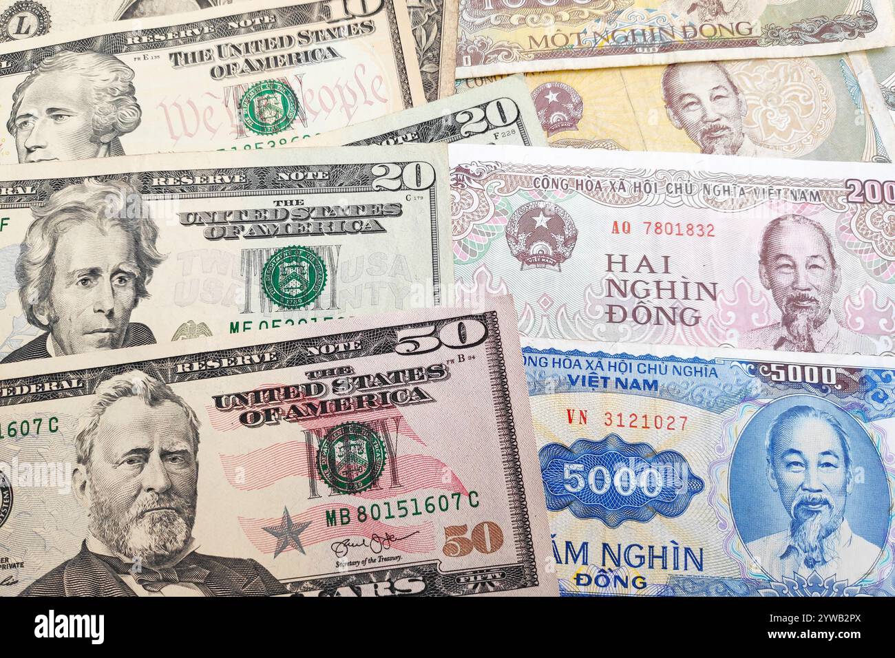 Close-up on a stack of US Dollar and Vietnamese Dong Stock Photo - Alamy