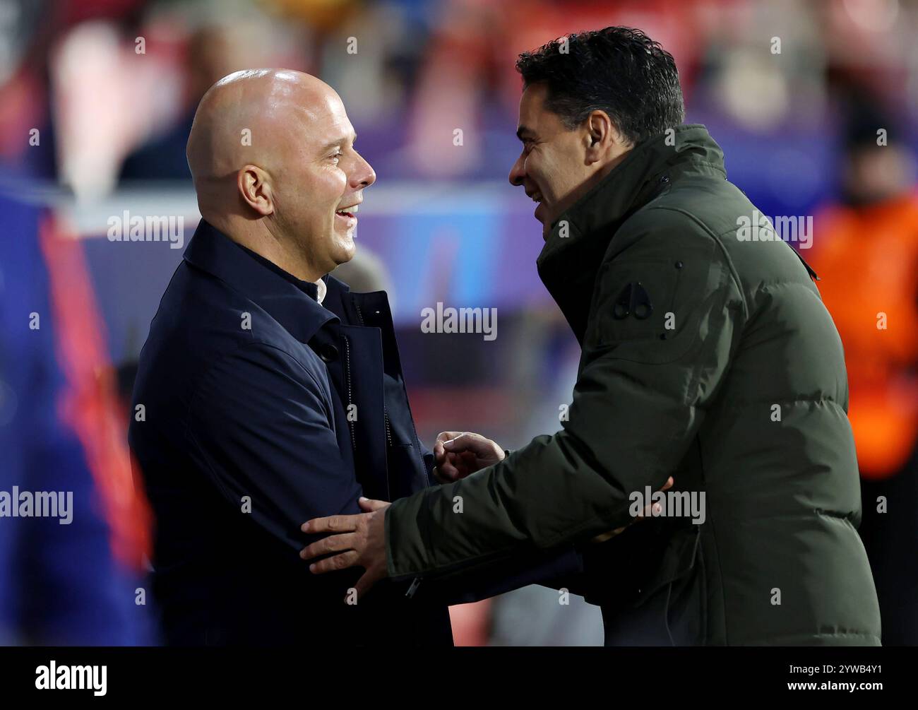 Liverpool manager Arne Slot (left) greets Girona manager Michel (right ...