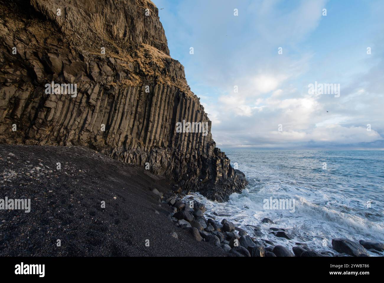 Basaltic lava flow solidified forming columns in the beaches of Vik ...