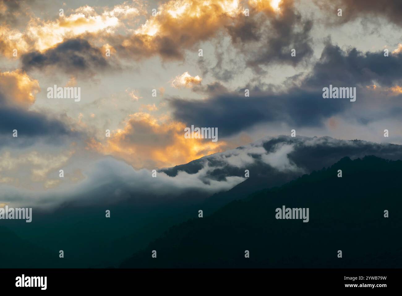 Dramatic clouds over Hiamalayan mountains after sun set, shot at Okhrey ...