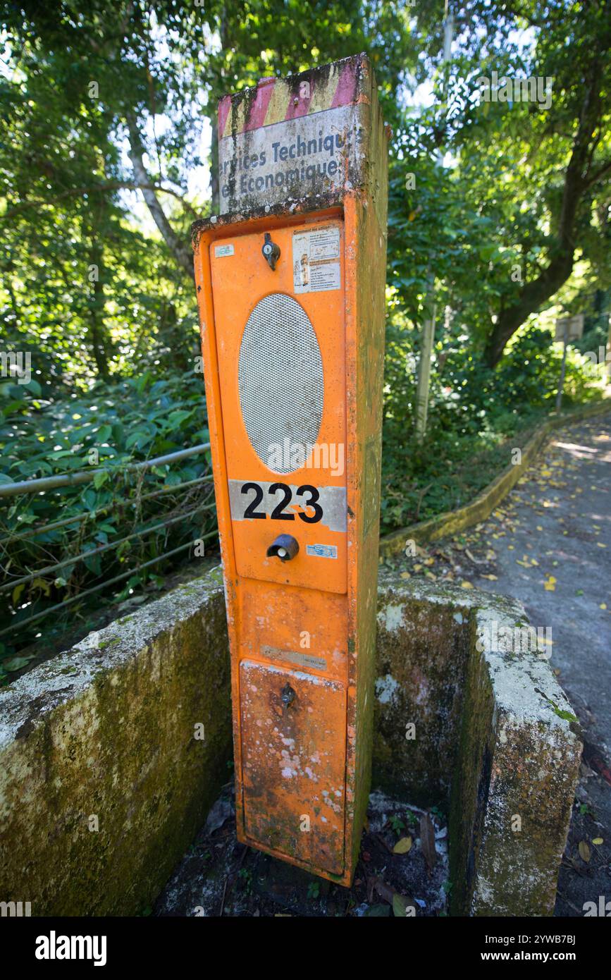Rusty telephone post at the Anse Couleuvre beach, Martinique, French ...