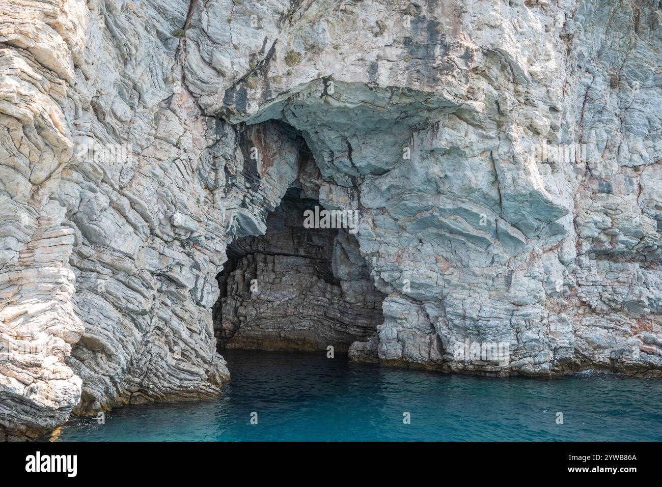 Phosphorous cave in the cliffs of southwestern coast of Cennet Island ...