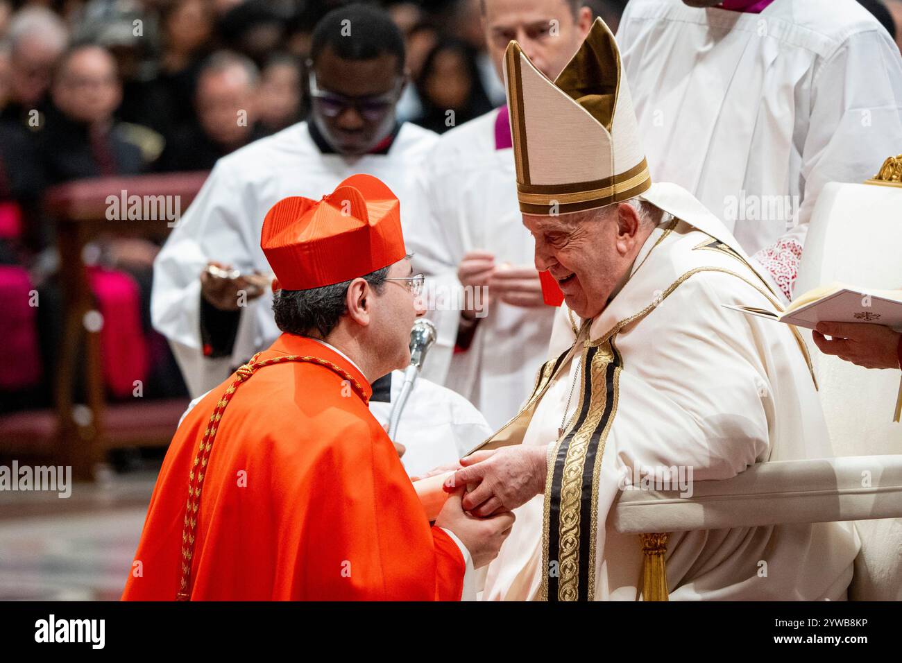 Pope Francis places the Cardinal's hat on the head of the new Cardinal ...