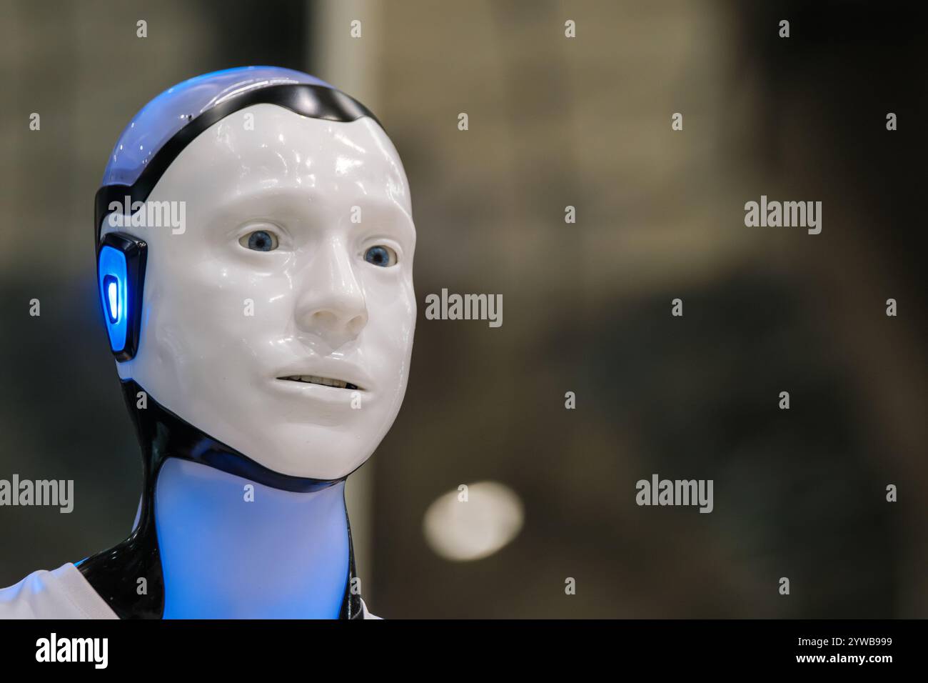 Close-up of a humanoid robot with glowing blue features, showcasing ...