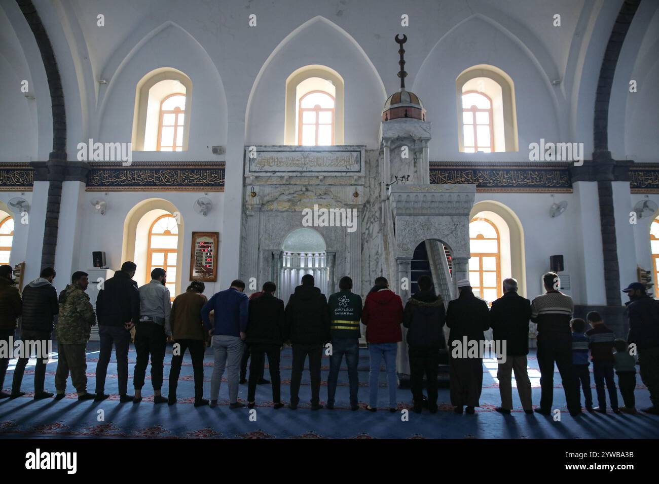Homs, Syria. 08 December 2024. Devotees pray in the Khalid ibn al-Walid ...