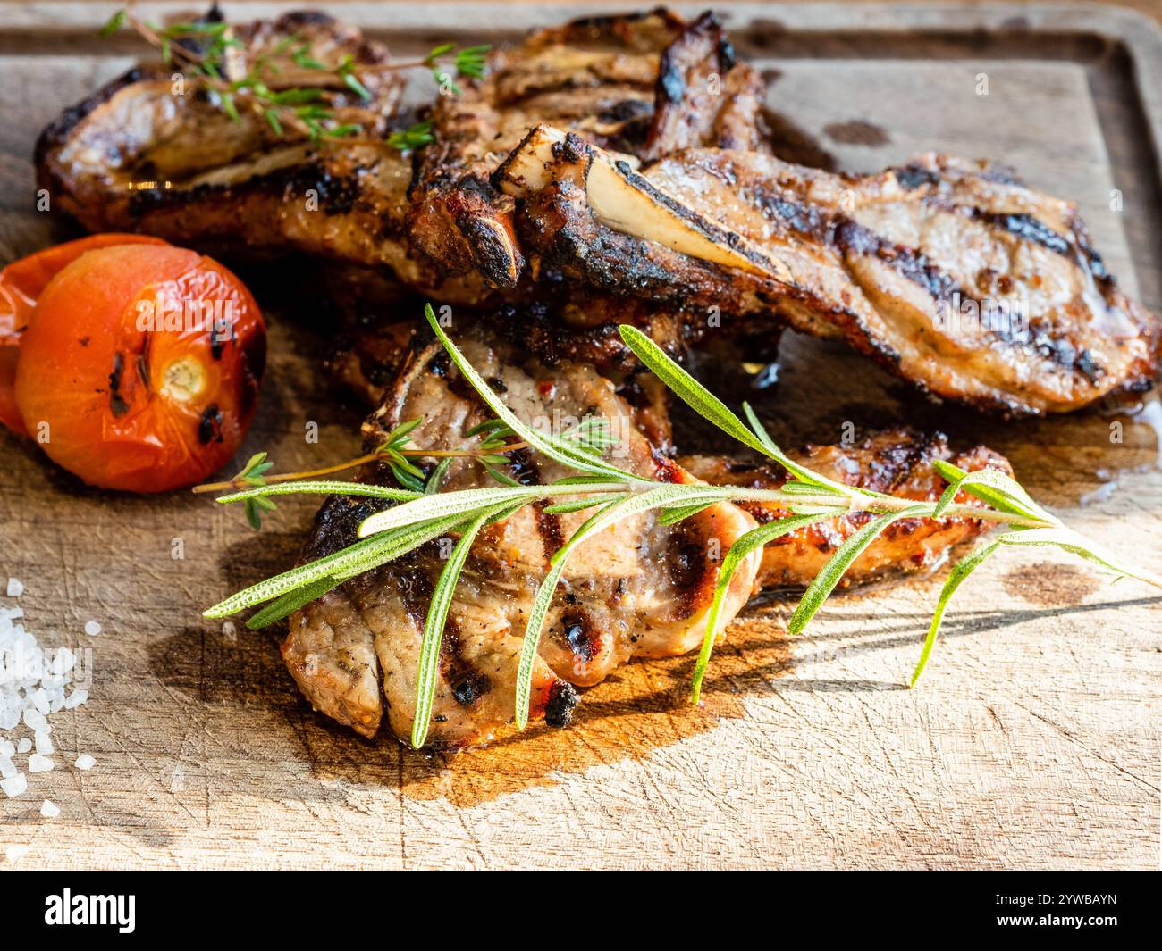 grilled saddle of lamb close up on wooden cutting board Stock Photo - Alamy