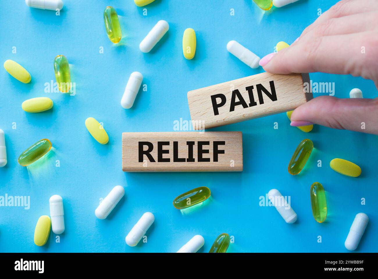 Pain Relief symbol. Concept word Pain Relief on wooden blocks ...