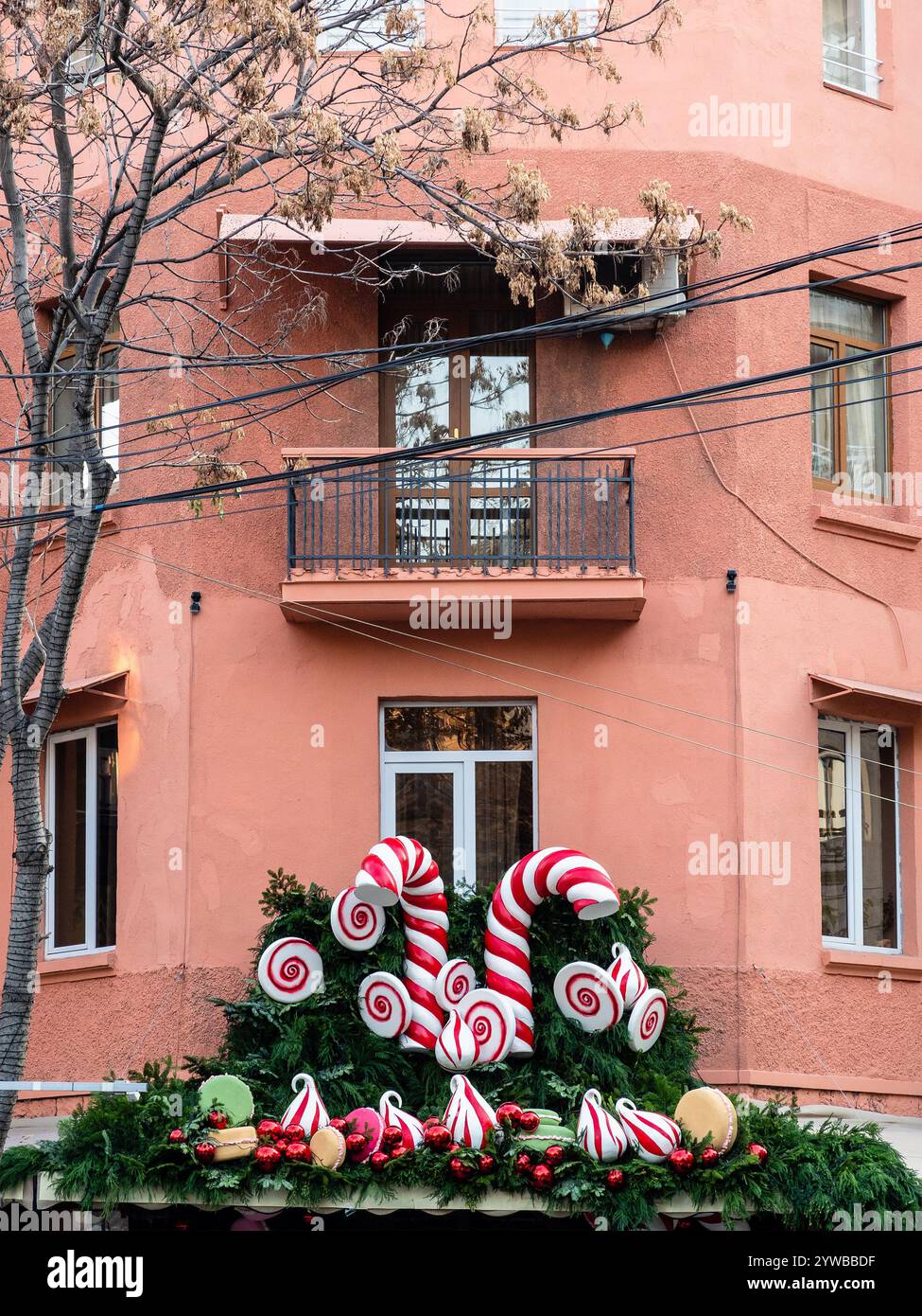 New Year decorations on pink wall of apartment building in Yerevan city ...