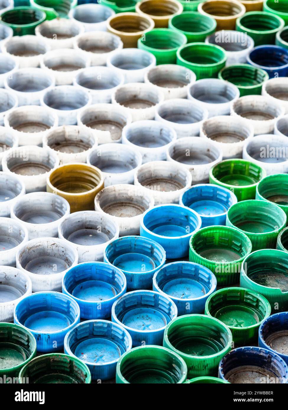 many used empty plastic bottle caps laid out on surface Stock Photo - Alamy
