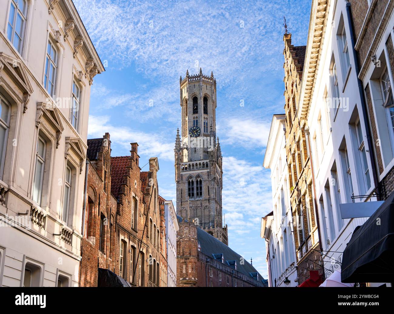 The Belfry Tower or Belfort and traditional old buildings in the narrow ...