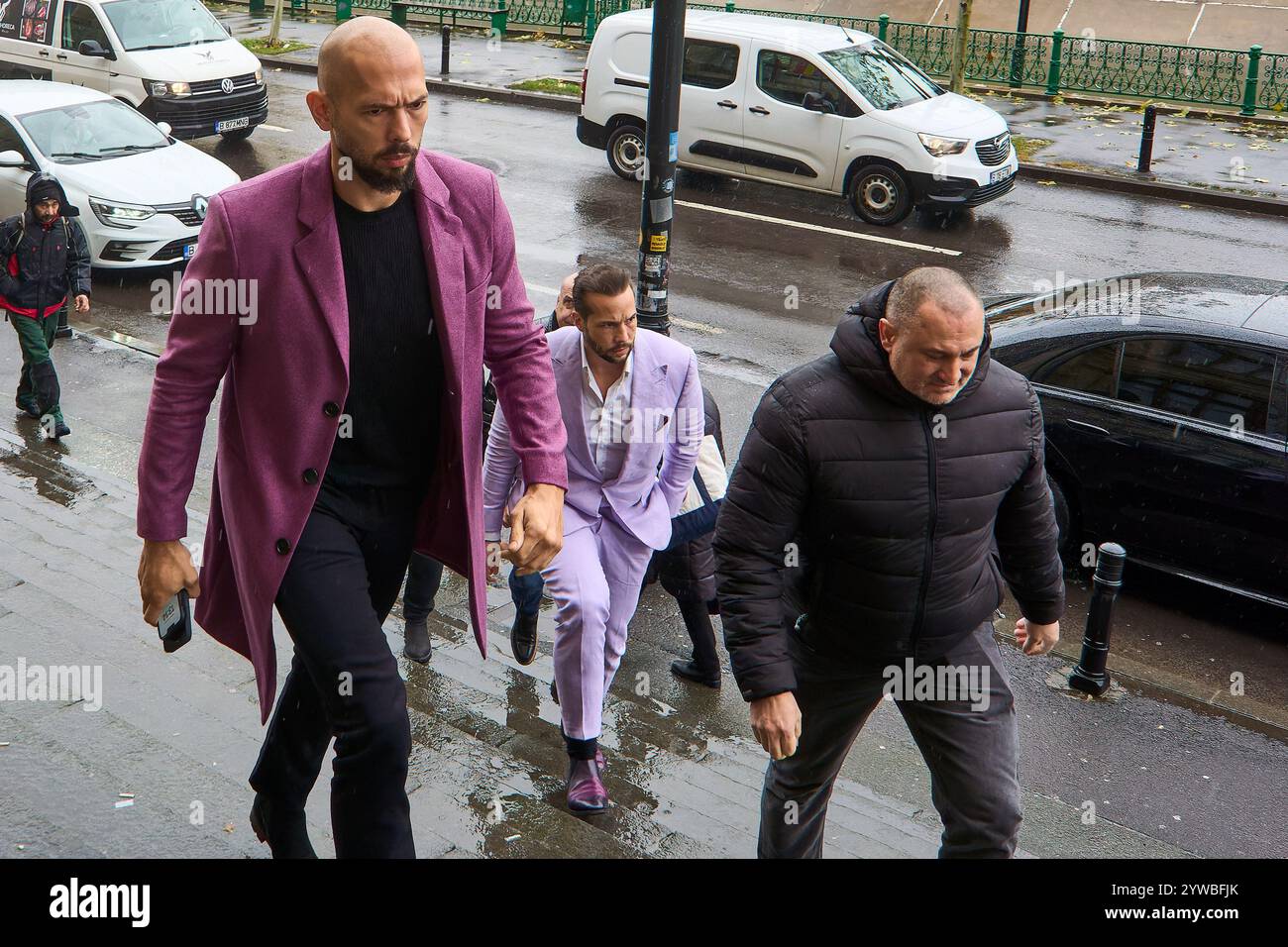 Bucharest, Romania. 10th Dec, 2024: Andrew Tate (L) and his brother Tristan Tate (C) arrive at ...