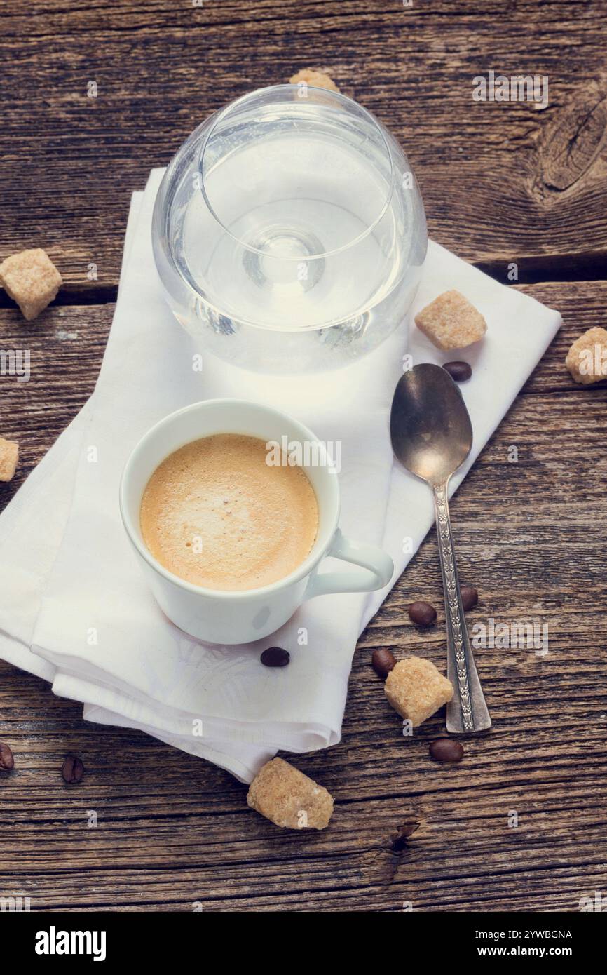 white cup with coffee on wooden table, color of the year 2025 mocha ...