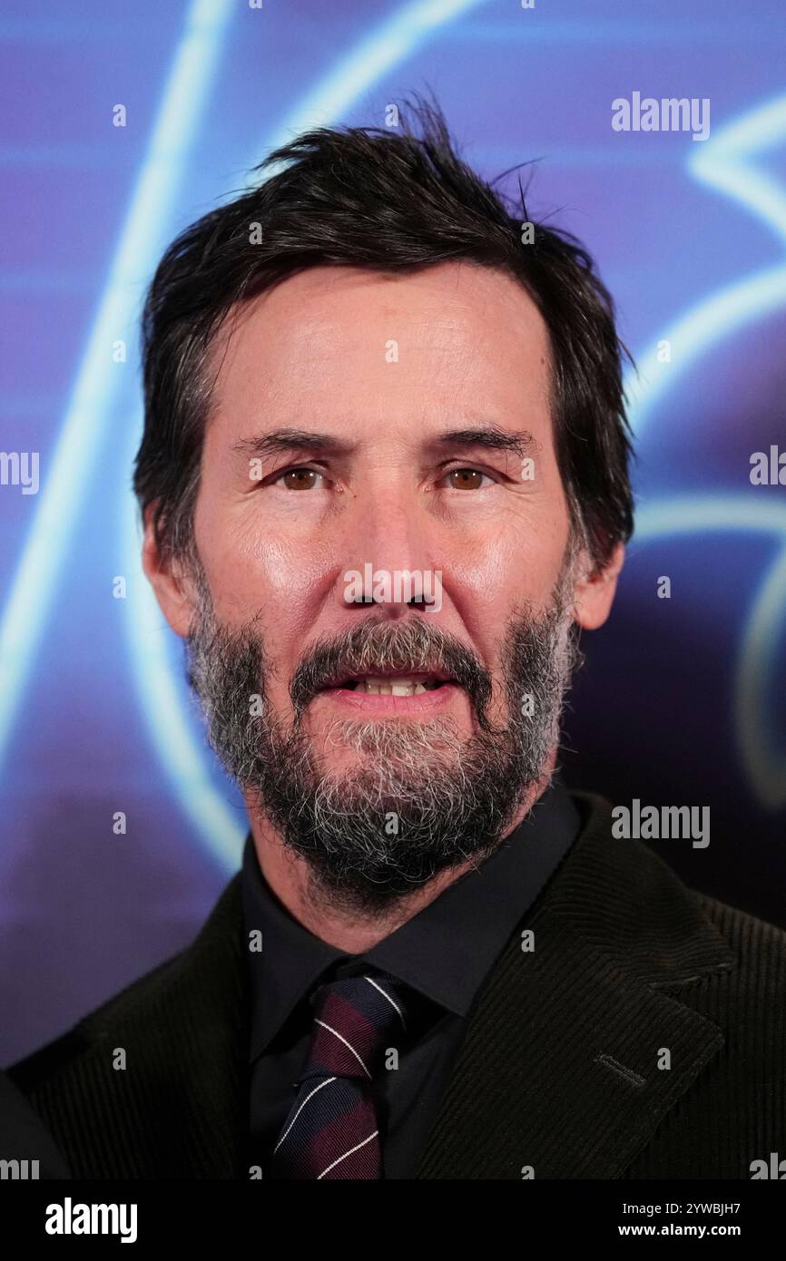 Keanu Reeves poses for photographers upon arrival at the premiere of ...