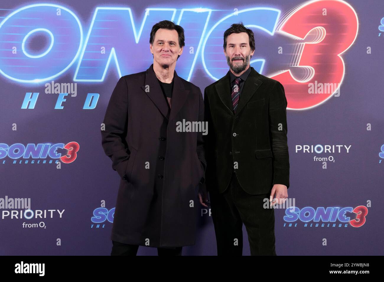 Jim Carrey, left and Keanu Reeves pose together for photographers upon ...