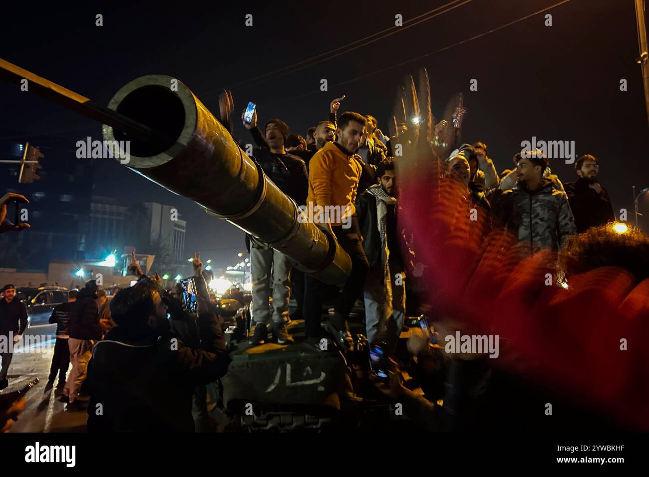 Syrians celebrate the arrival of opposition fighters in Damascus, Syria ...