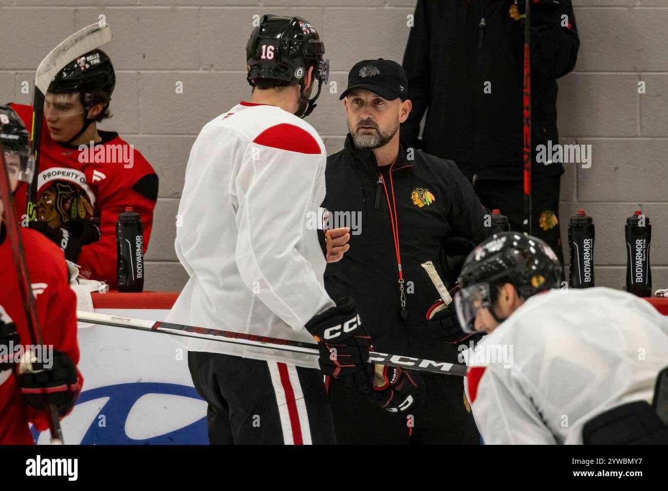Chicago Blackhawks interim head coach Anders Sorensen speaks with Jason ...
