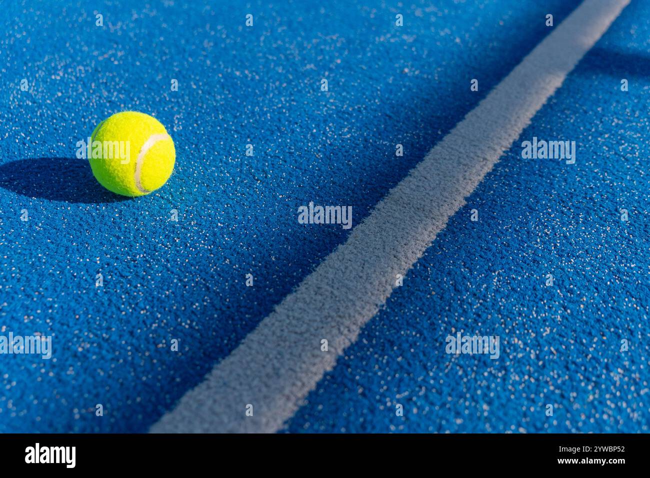 paddle ball on a blue paddle tennis court, background padel concept ...