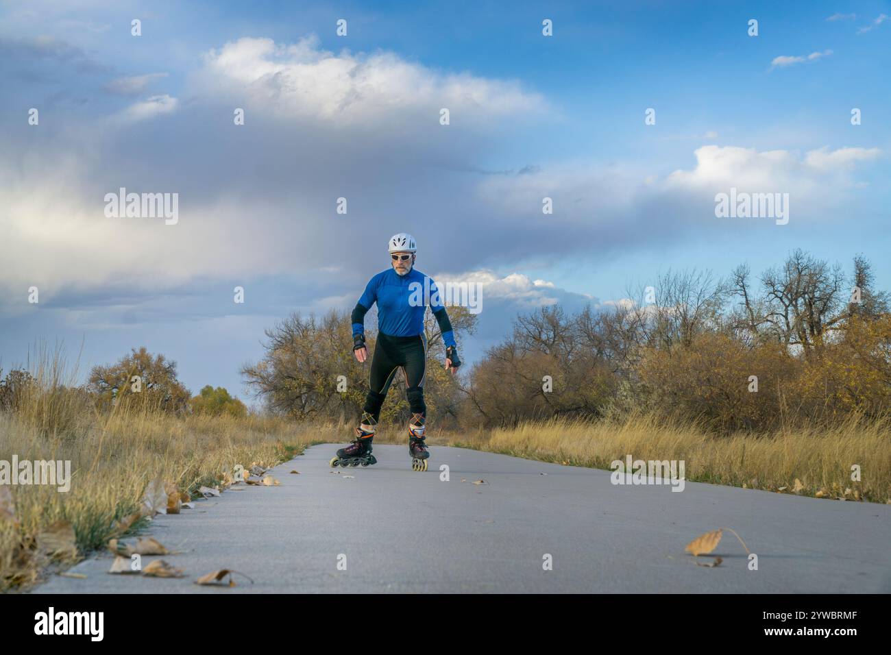 Senior athletic male inline skating on the Poudre RIver Trail in ...