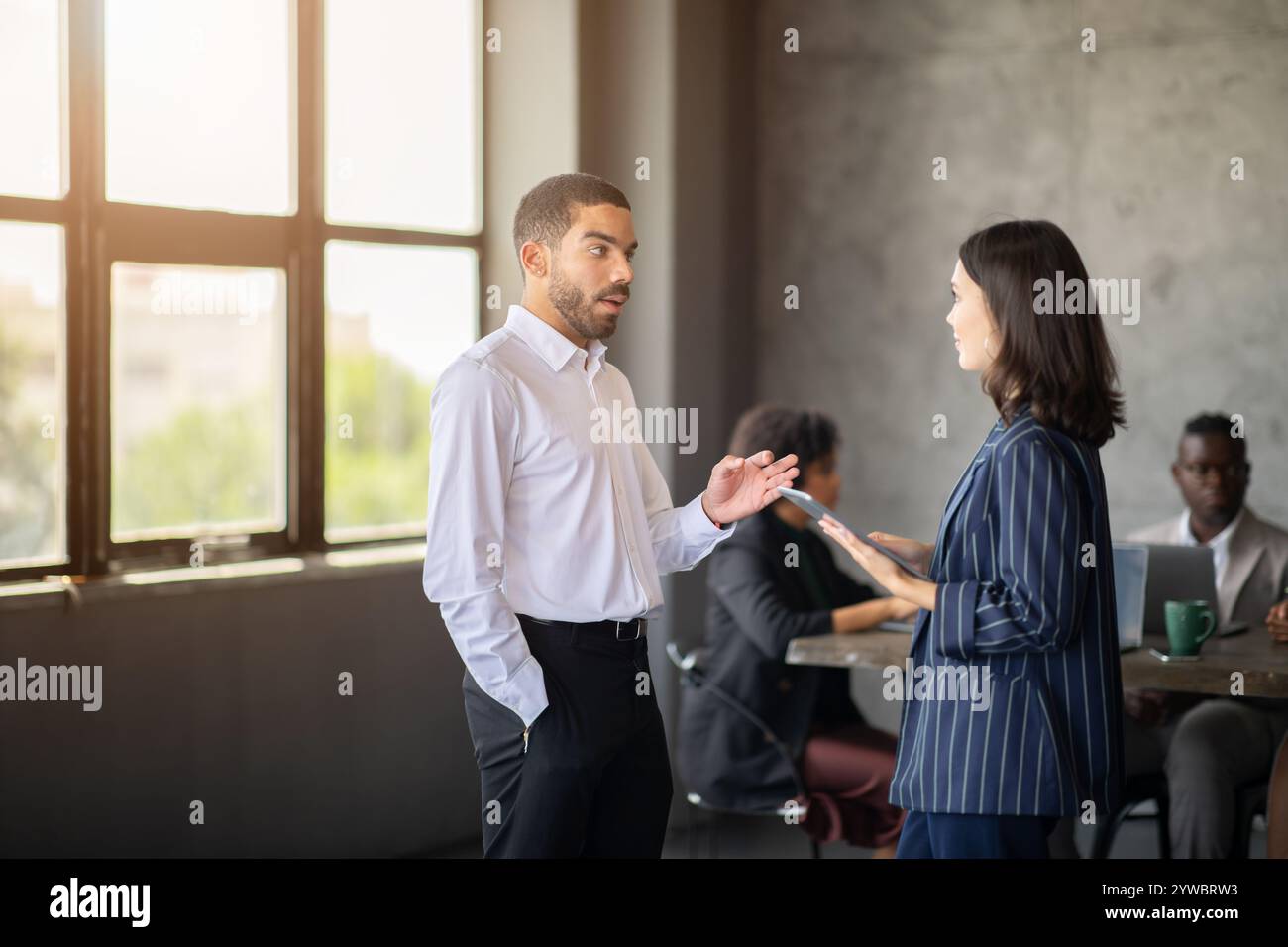 Team members collaborating in business hi-res stock photography and ...