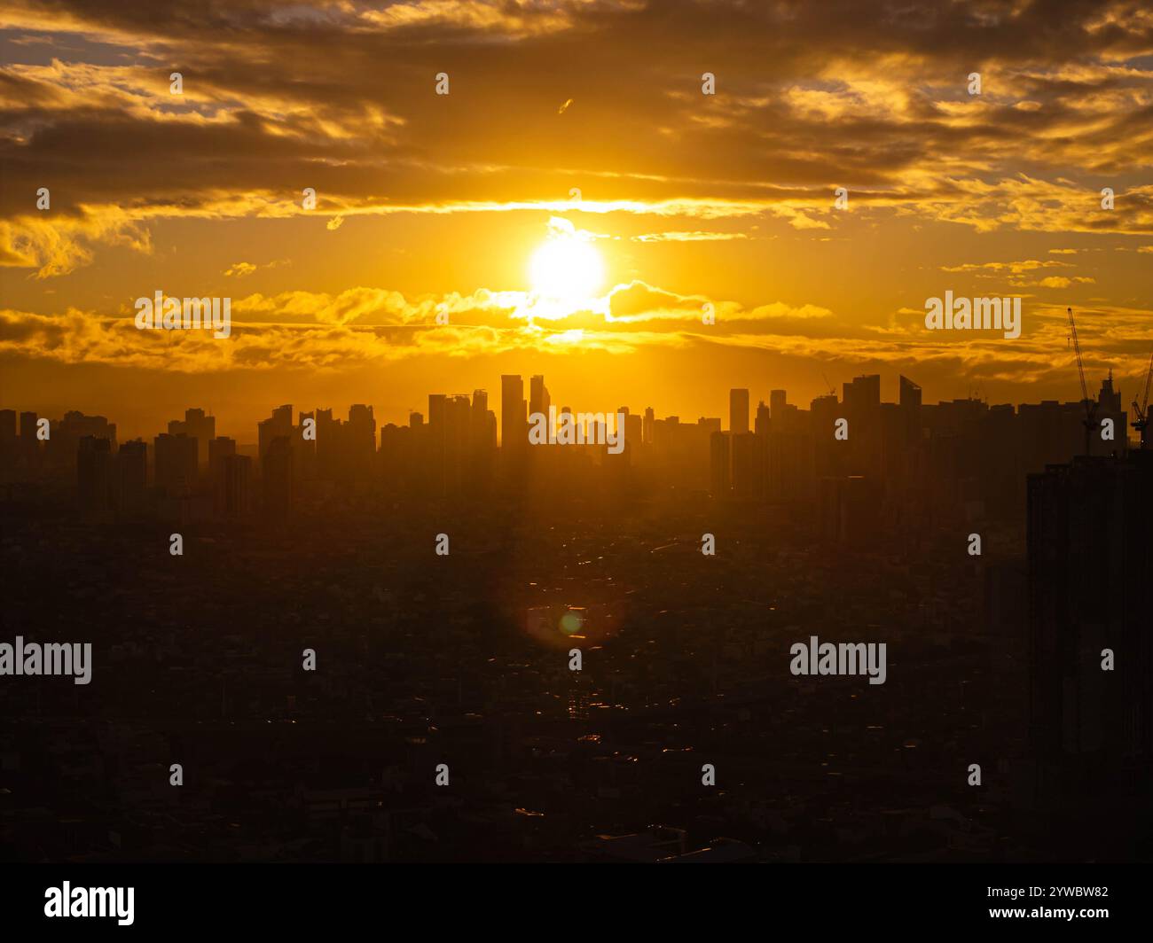 Glowing sunset casting stunning silhouette of Manila city skyline ...