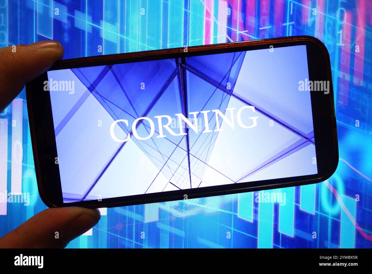 In this photo illustration, the Corning company logo is seen displayed ...