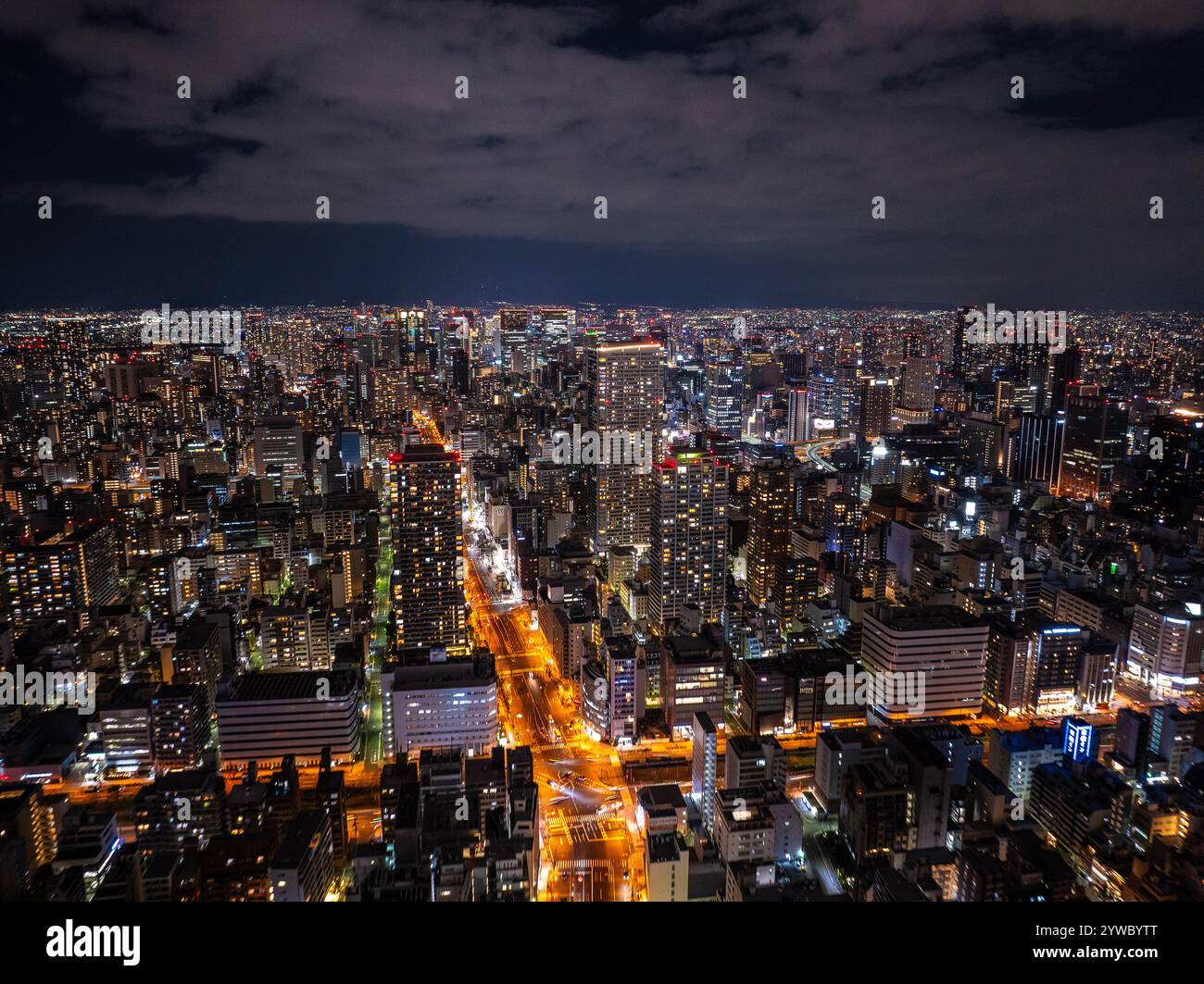 Osaka's at night with high rise buildings and illuminated streets ...