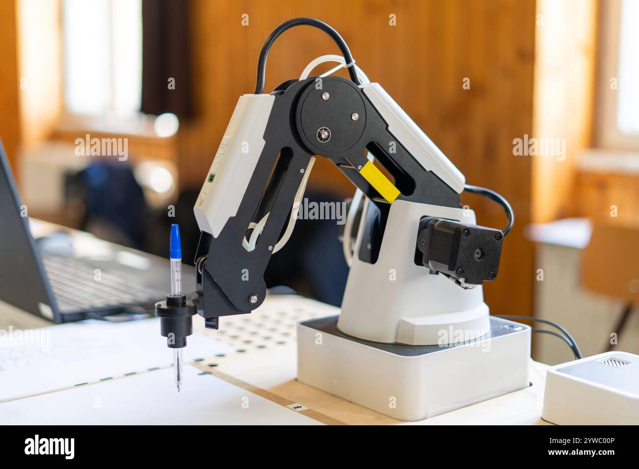 A robotic arm holding a pen Stock Photo - Alamy
