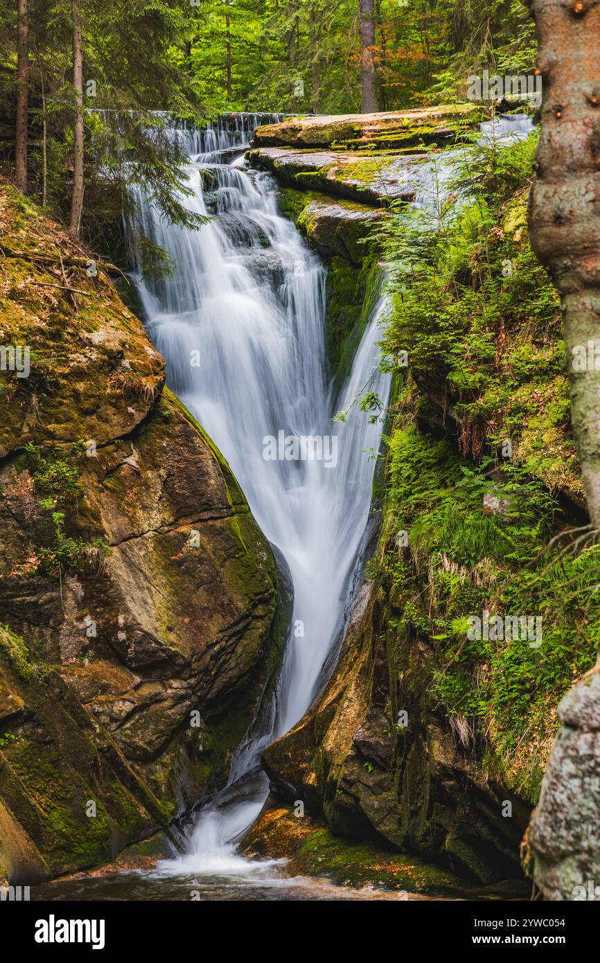 Beautiful giant Szklarka waterfall with giant rocks around and green ...