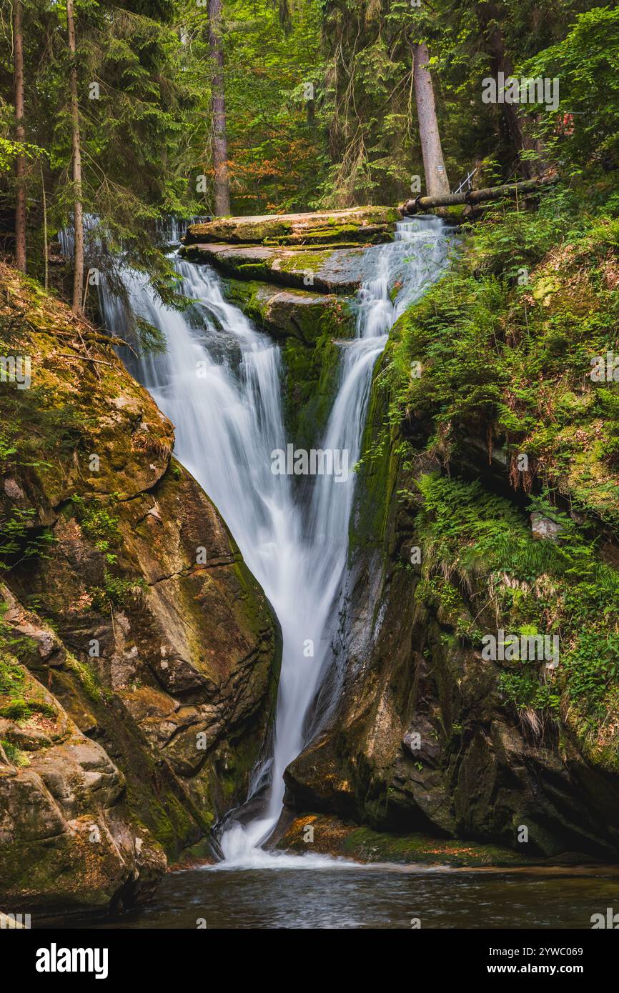 Beautiful giant Szklarka waterfall with giant rocks around and green ...