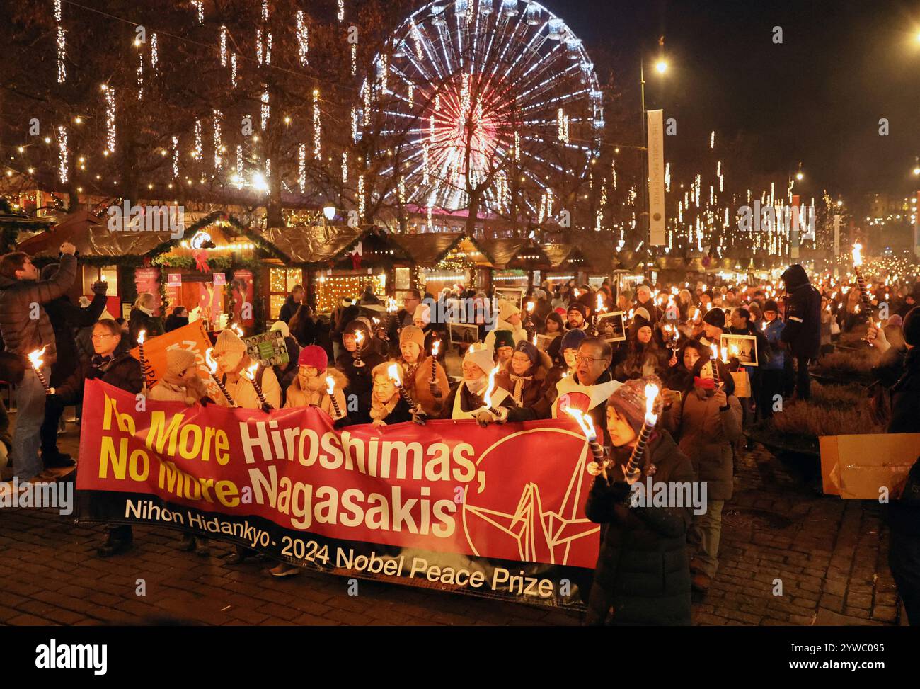 Atomic bomb survivors and Oslo residents march through the city holding ...