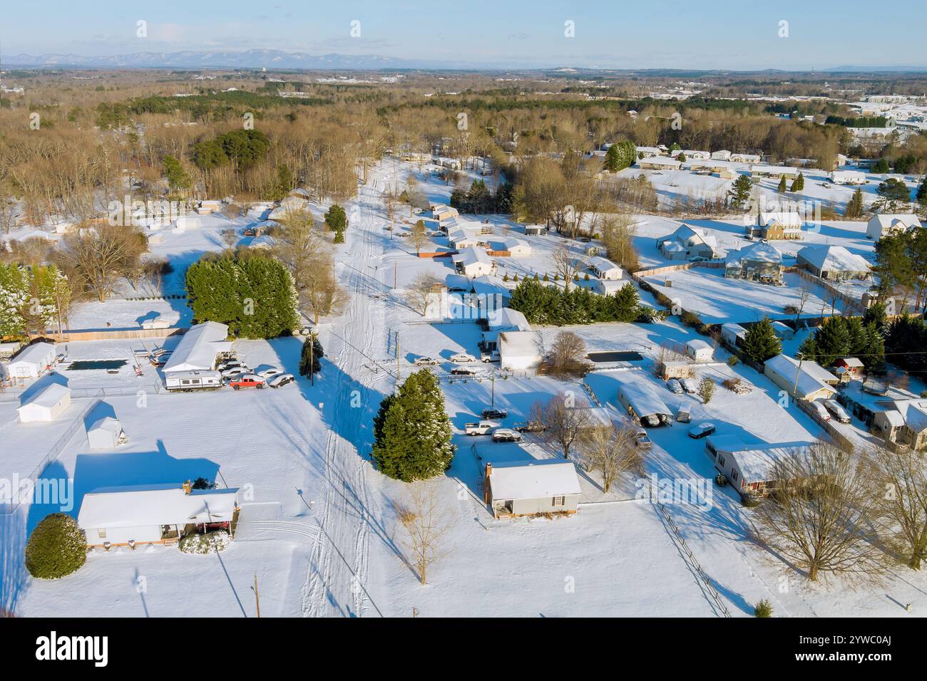 In serene winter setting, snowy American suburban landscape shows ...