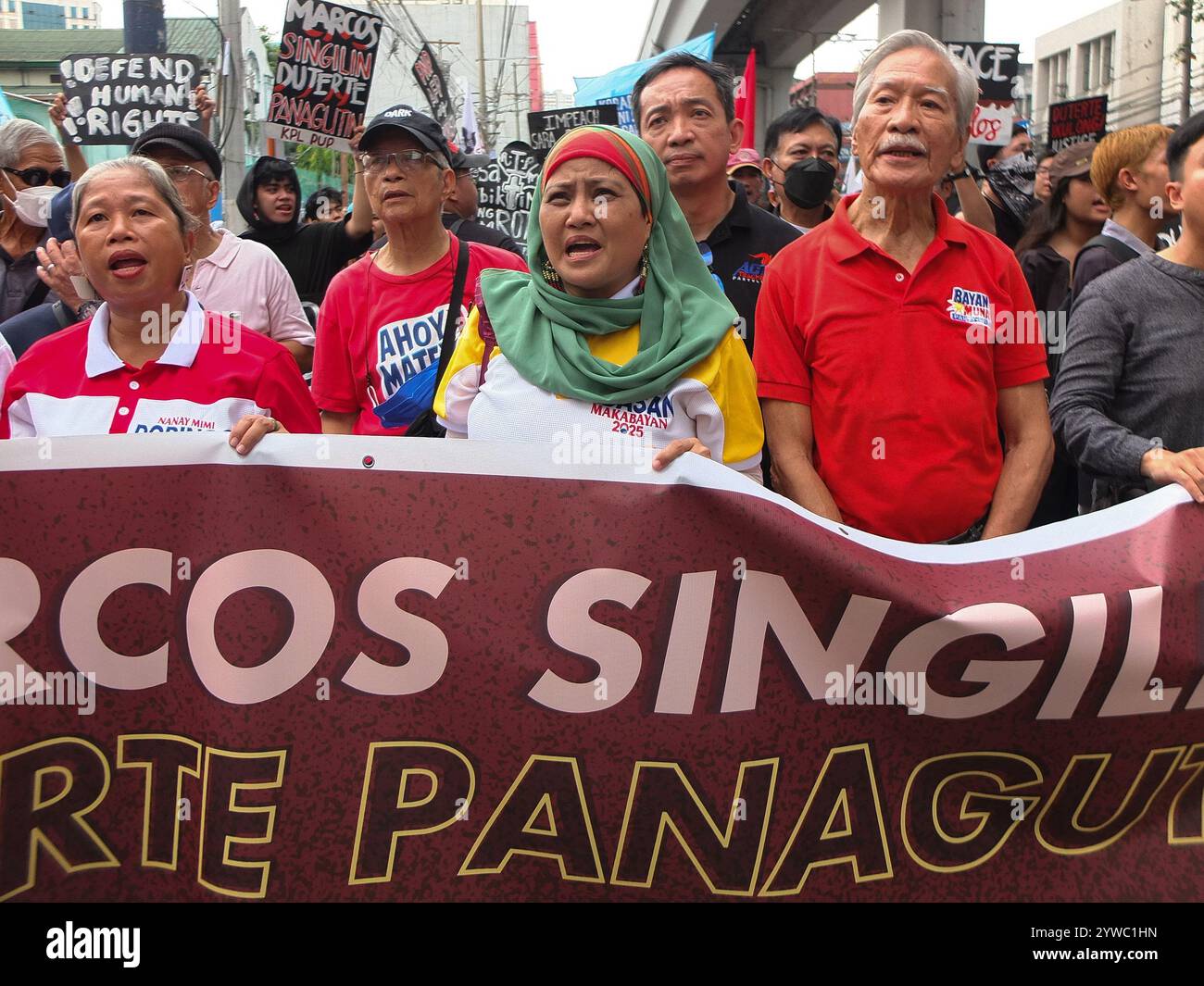 Former Congressman Satur Ocampo and other protesters chanting while ...