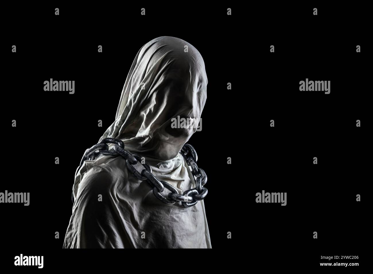 Portrait of a scary ghost with chains isolated on black background with ...