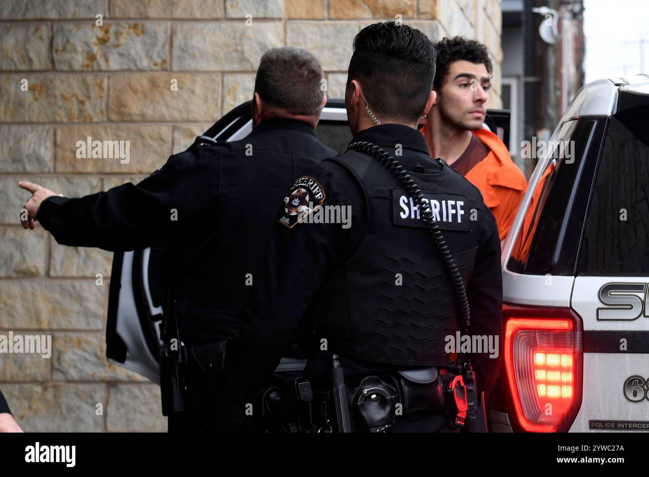 Luigi Nicholas Mangione is escorted into Blair County Courthouse ...