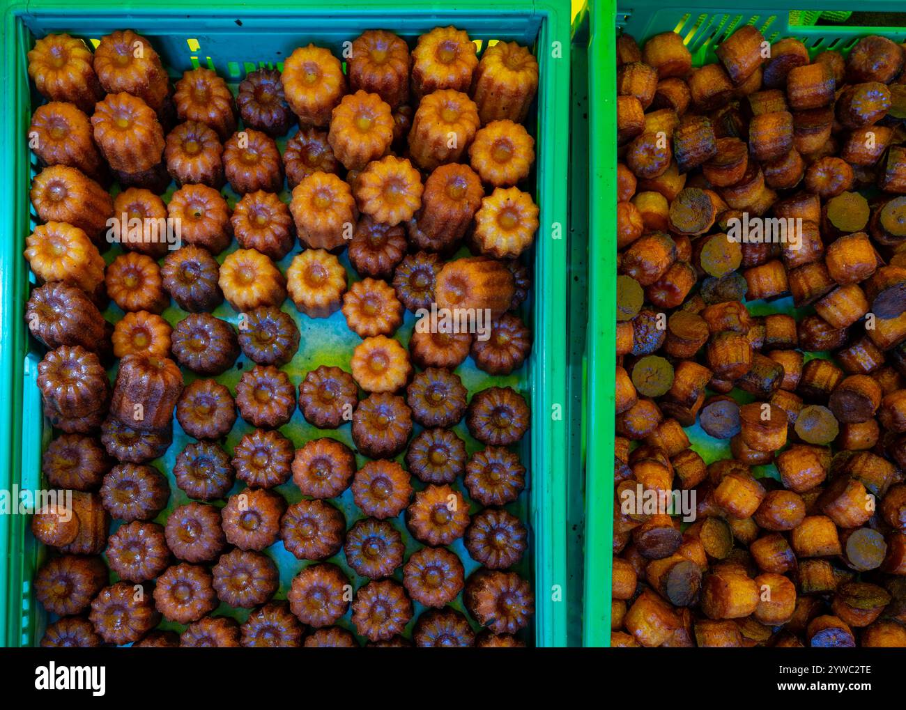 Baked Canele, French pastry flavored with rum and vanilla, specialty of ...