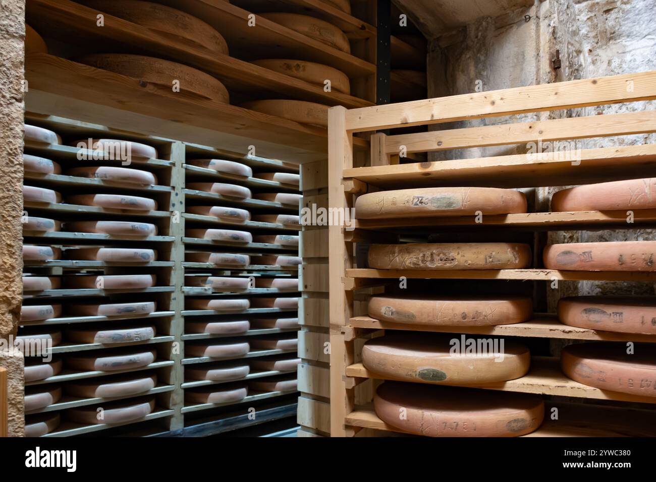 Aging rooms with many shelves in cheese caves, central location for ...